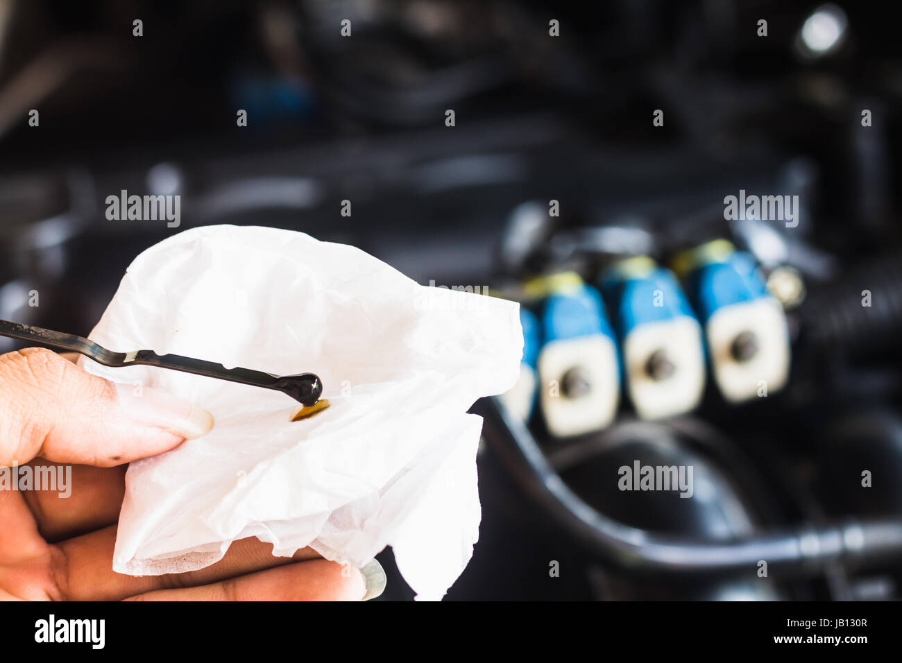 Oil gauge car checking to save engine for long life Stock Photo - Alamy