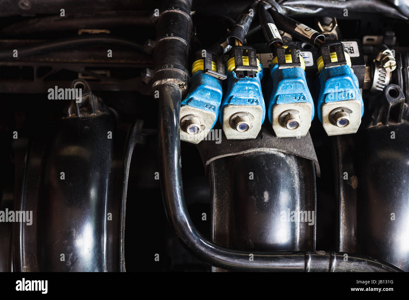 blue color LPG fuel injection focus in engine room Stock Photo - Alamy