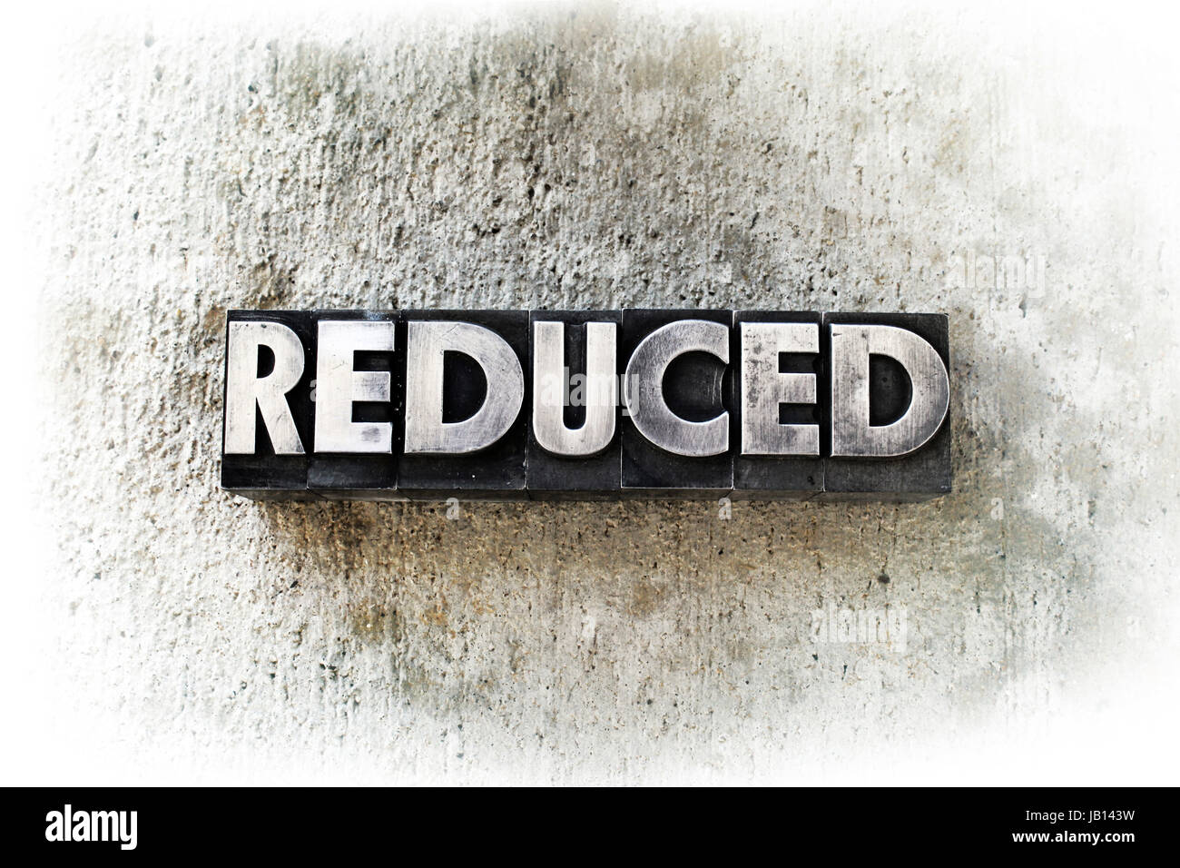 The word "REDUCED" written in old vintage letterpress type Stock Photo ...