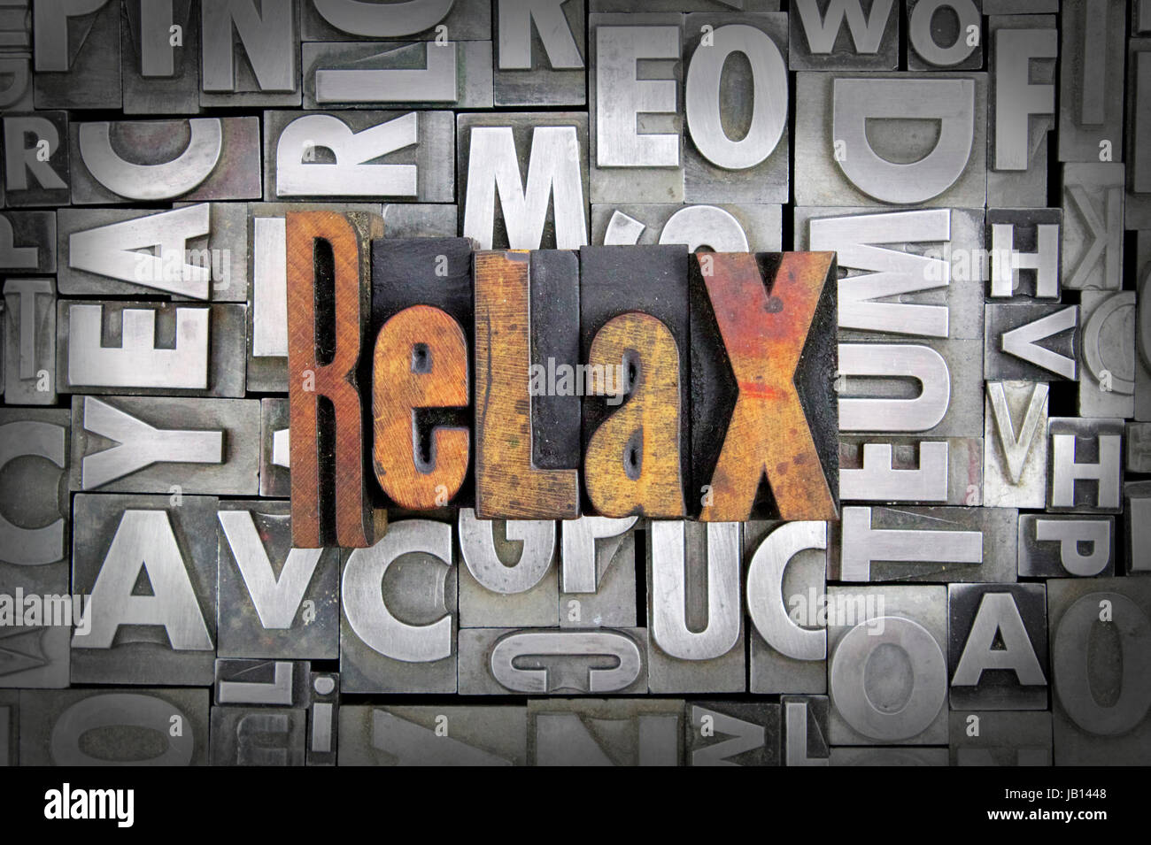 Relax written in vintage letterpress type Stock Photo - Alamy