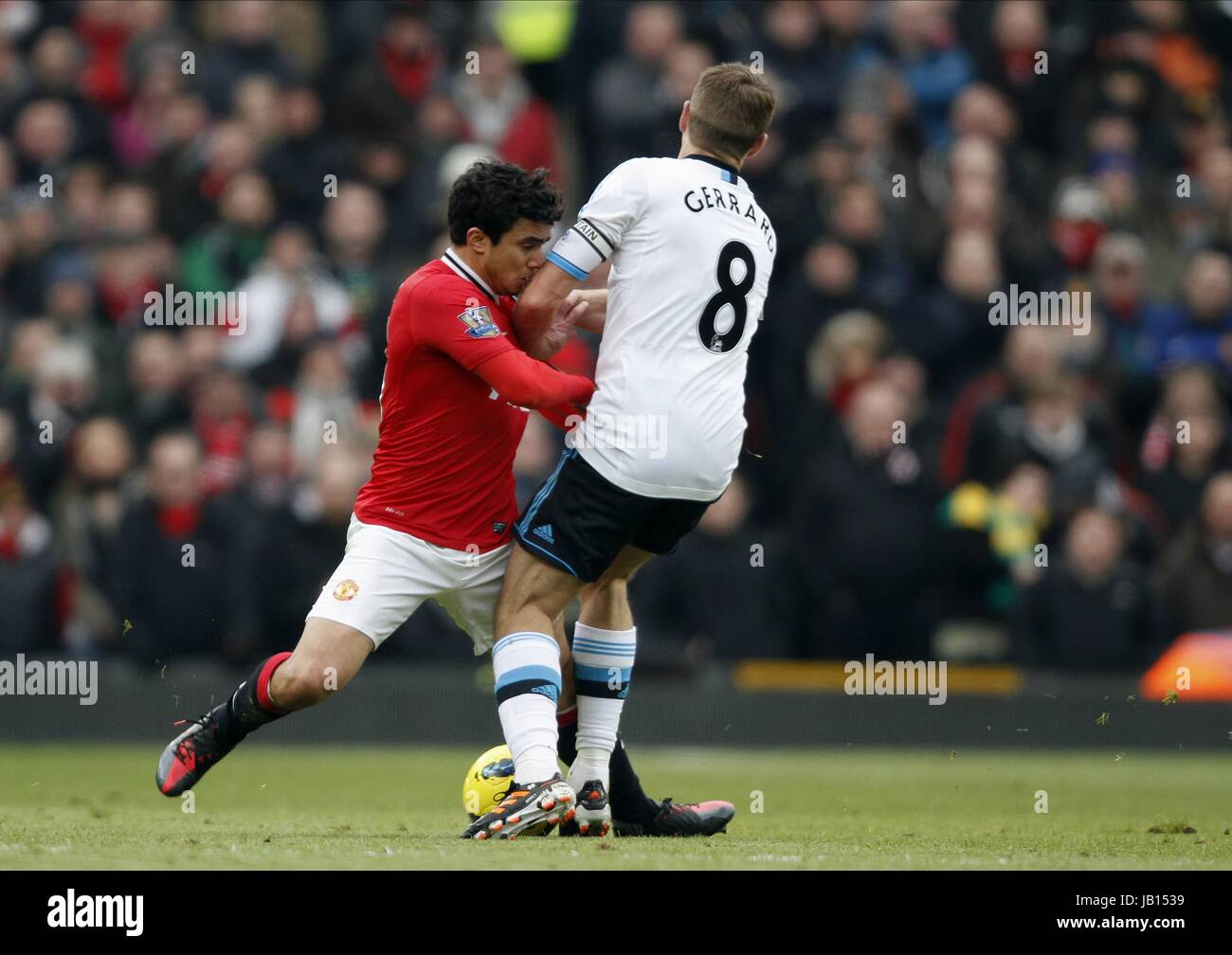 Rafael da silva runs into steven gerrards arm hi-res stock photography ...