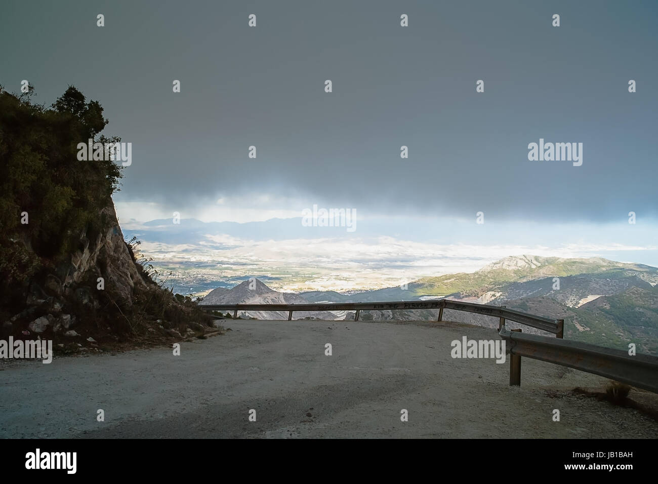 The road down from the mountain was very narrow and the rails had seen ...