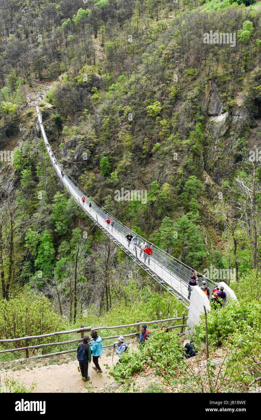 Sementina, Switzerland: people walking on the suspension bridge over ...