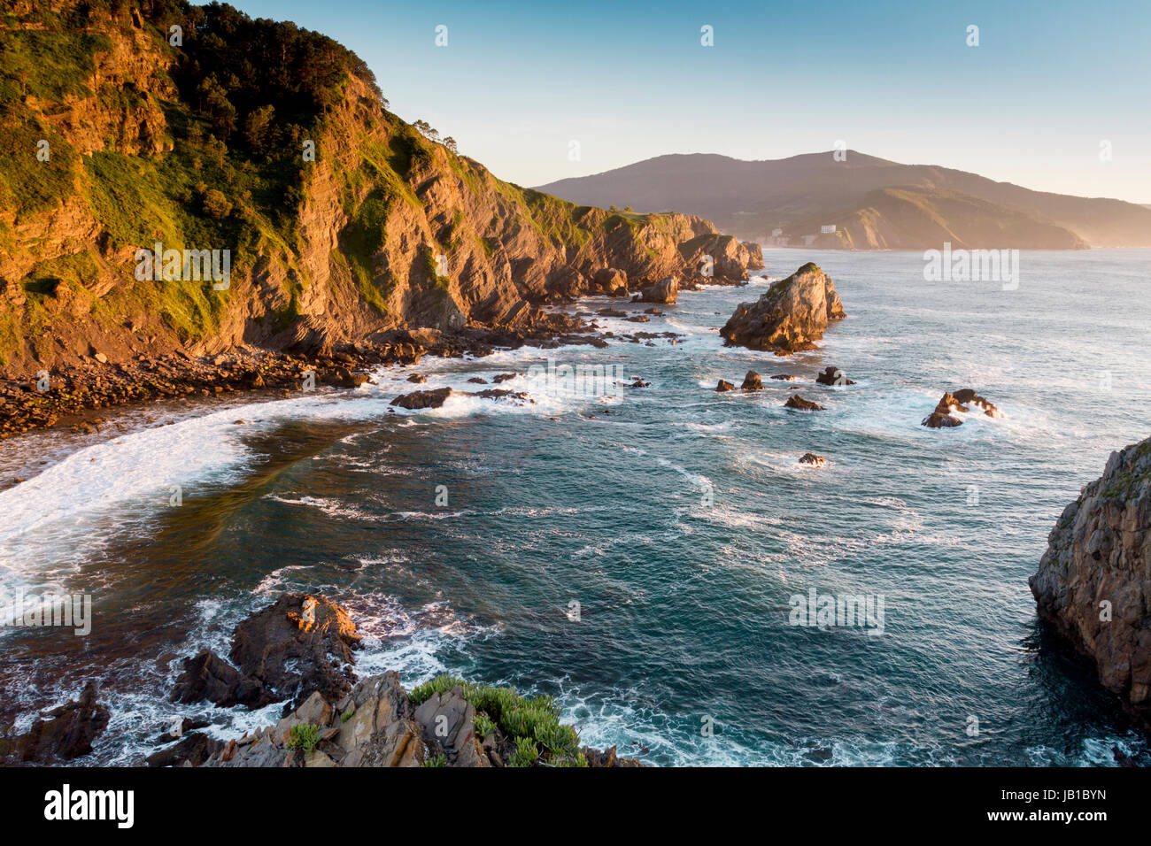 Golden hour light on the coastal rock formations of San Juan de ...