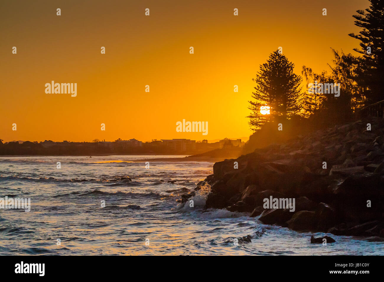 A beautiful sunset at the beach town of Caloundra in Queensland ...