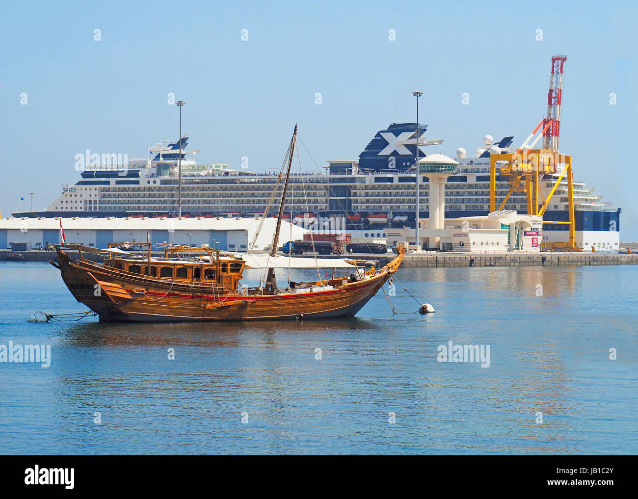 Port of Muscat with Arab dhow and cruise ship Celebrity Constellation ...