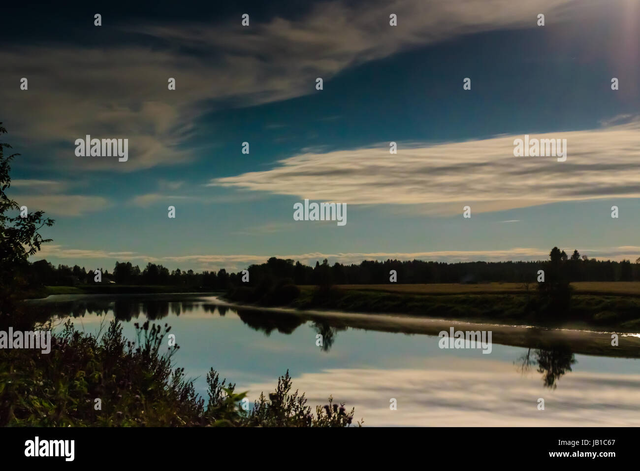 The full moon shines bright over the river Pyhajoki in the Northern ...