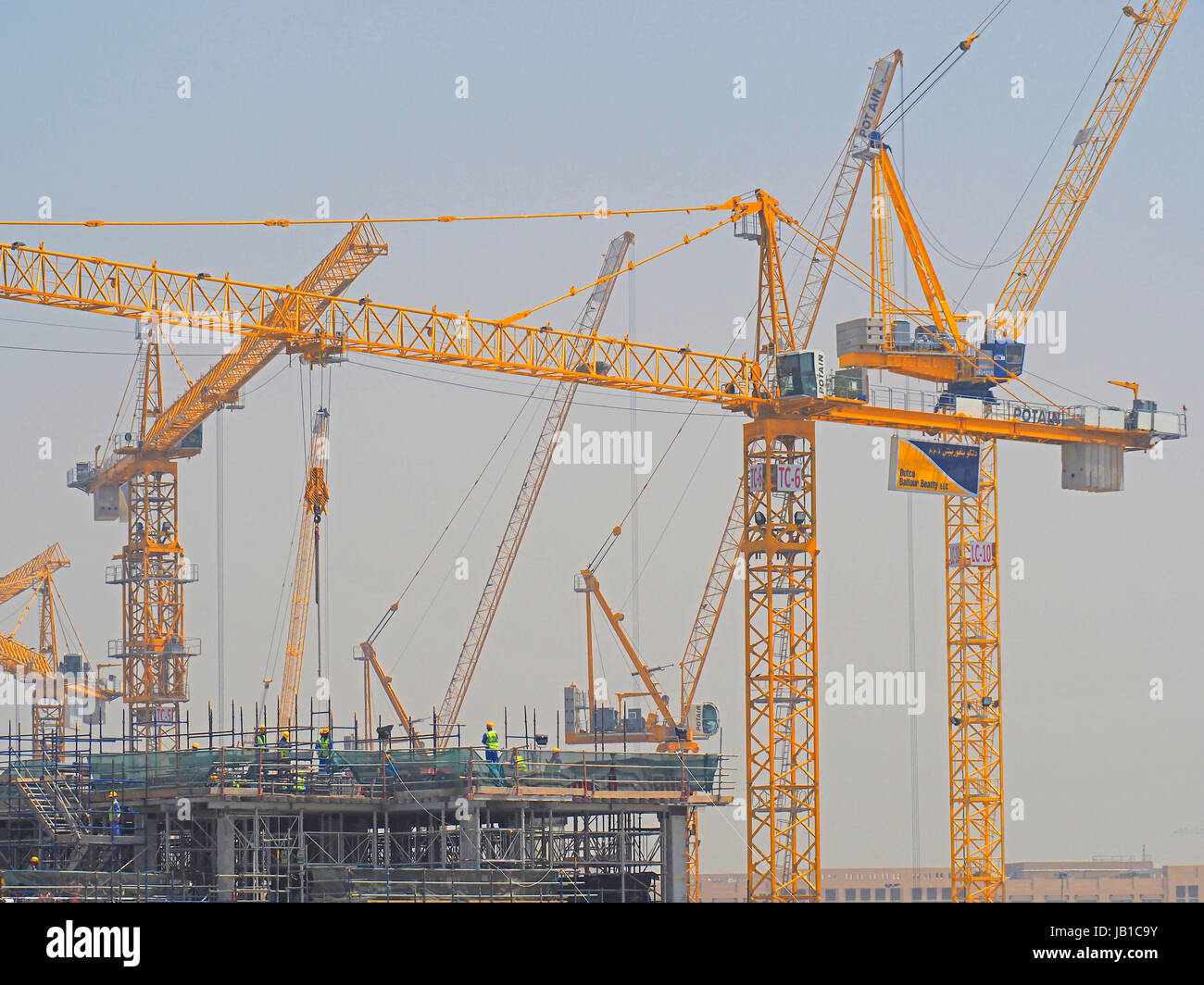 Construction cranes in Dubai, UAE Stock Photo - Alamy