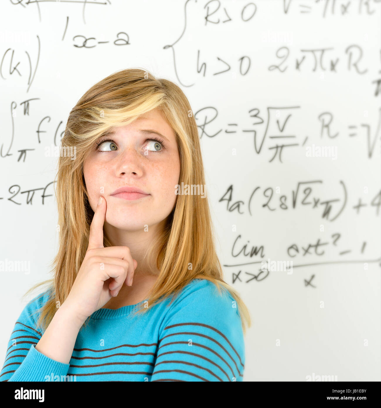 Thinking student teenager standing in front of mathematics board Stock ...
