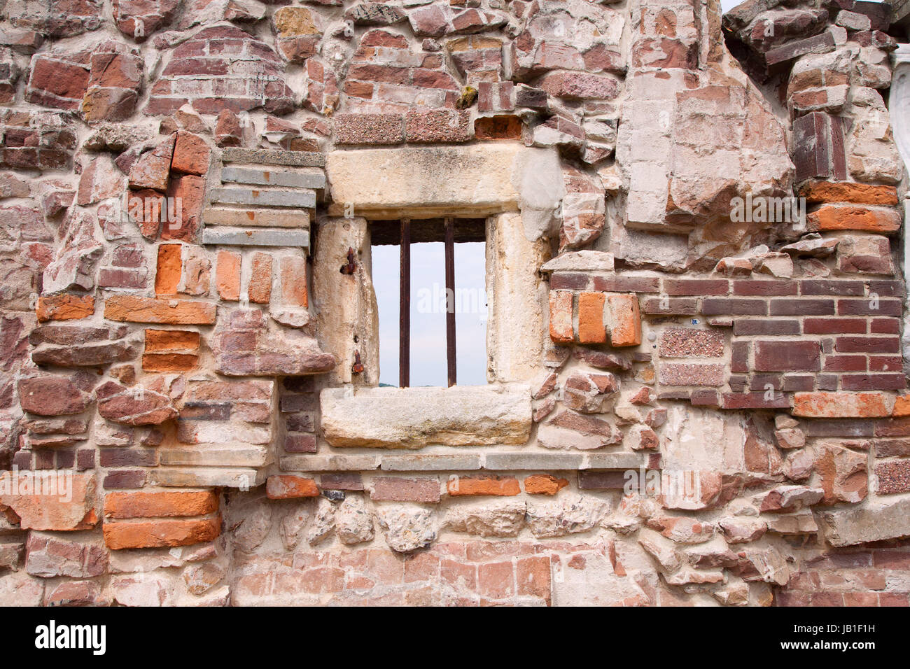 Stone wall made of a variety of rocks and bricks Stock Photo - Alamy