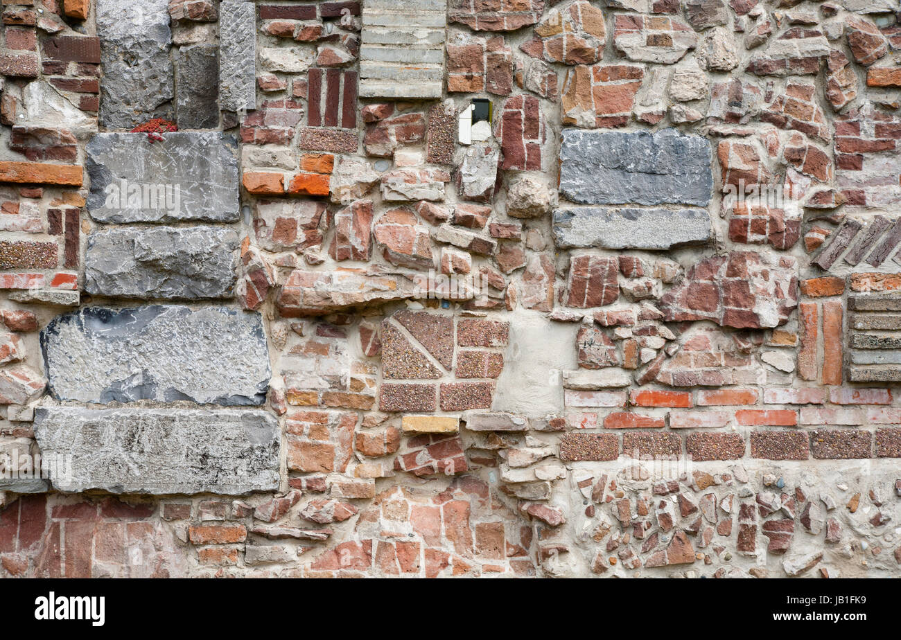 Stone wall made of a variety of rocks and bricks Stock Photo - Alamy
