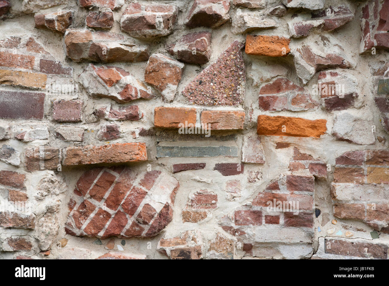 Stone wall made of a variety of rocks and bricks Stock Photo - Alamy