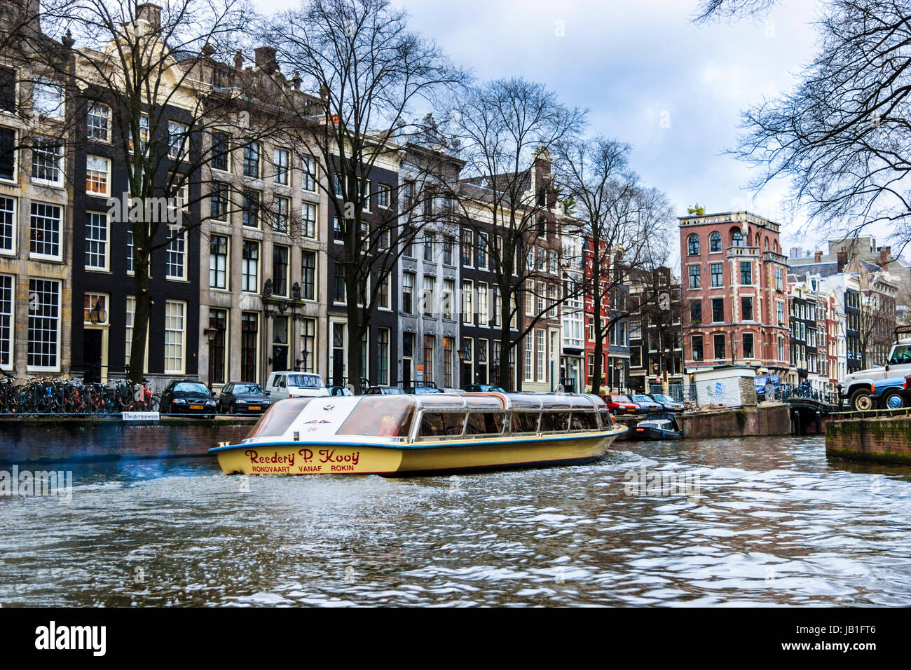 Dutch tourist pleasure boat on an excursion along a canal, Amsterdam ...