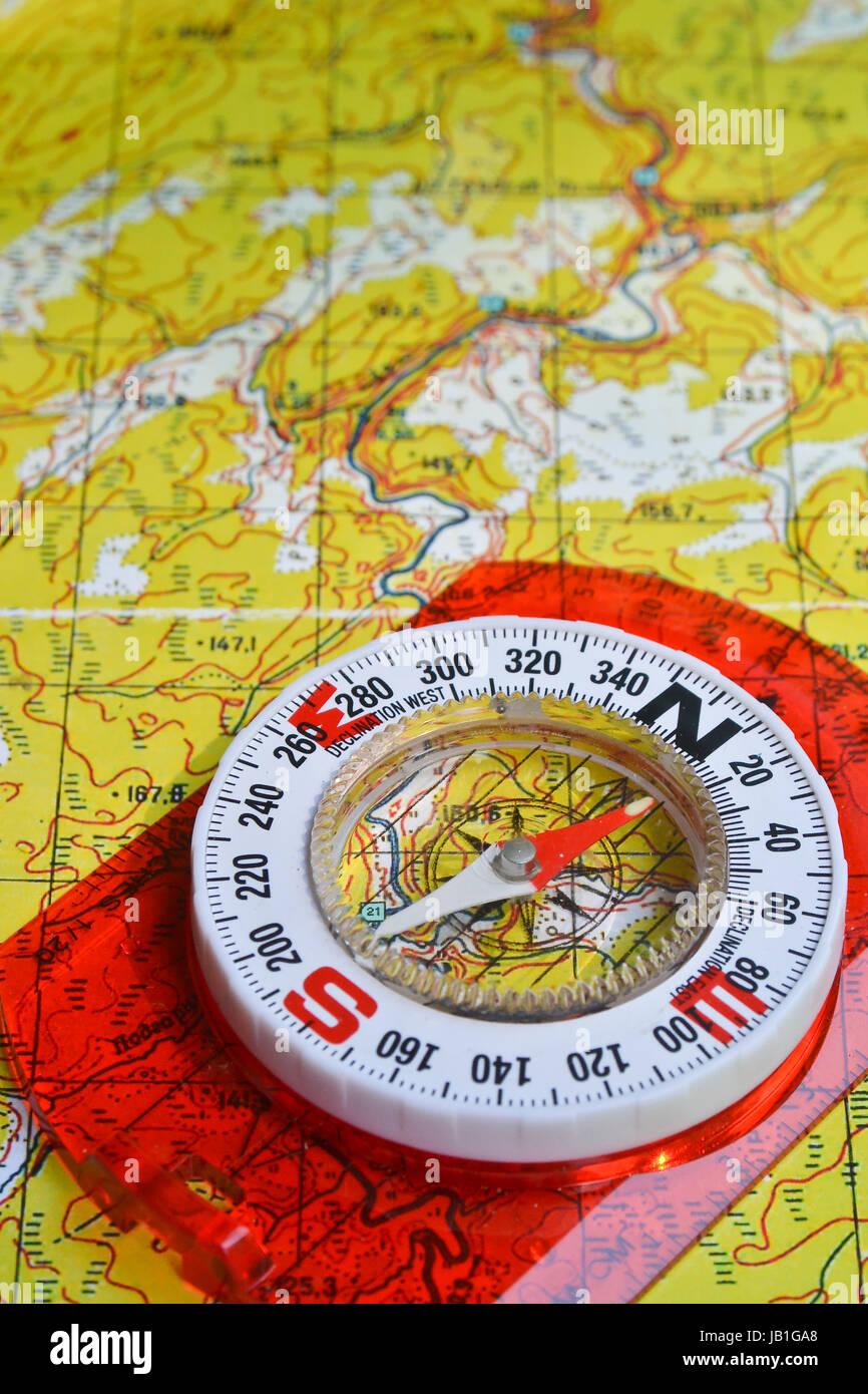 A map with a compass. On a trip - with reliable navigation Stock Photo ...