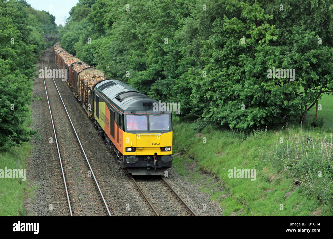 A Colas diesel locomotive passing through Moore pulling a train loaded ...
