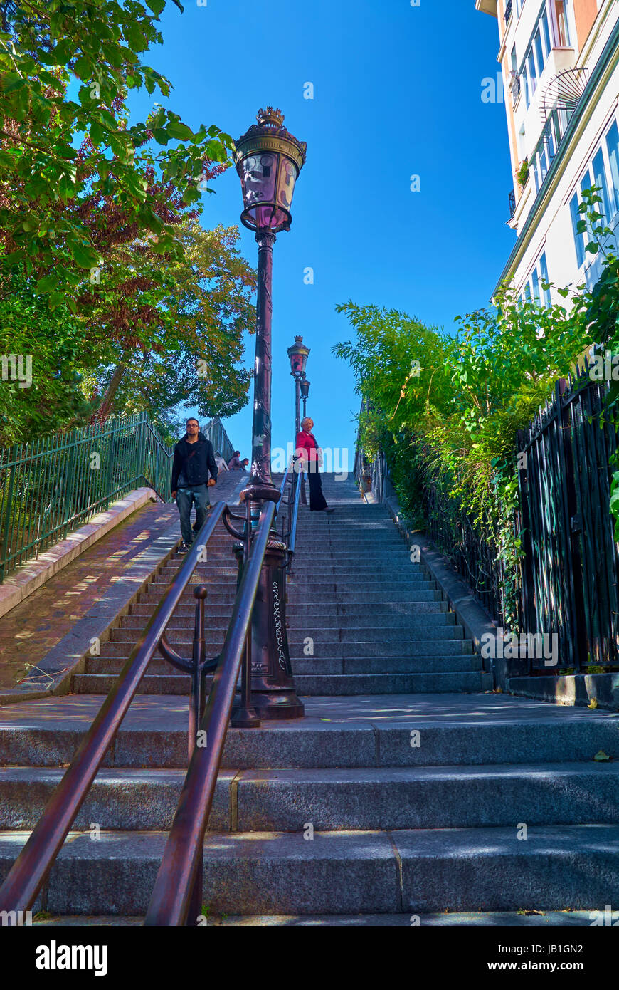 Two people on steps in Montmarte, Paris, France Stock Photo - Alamy