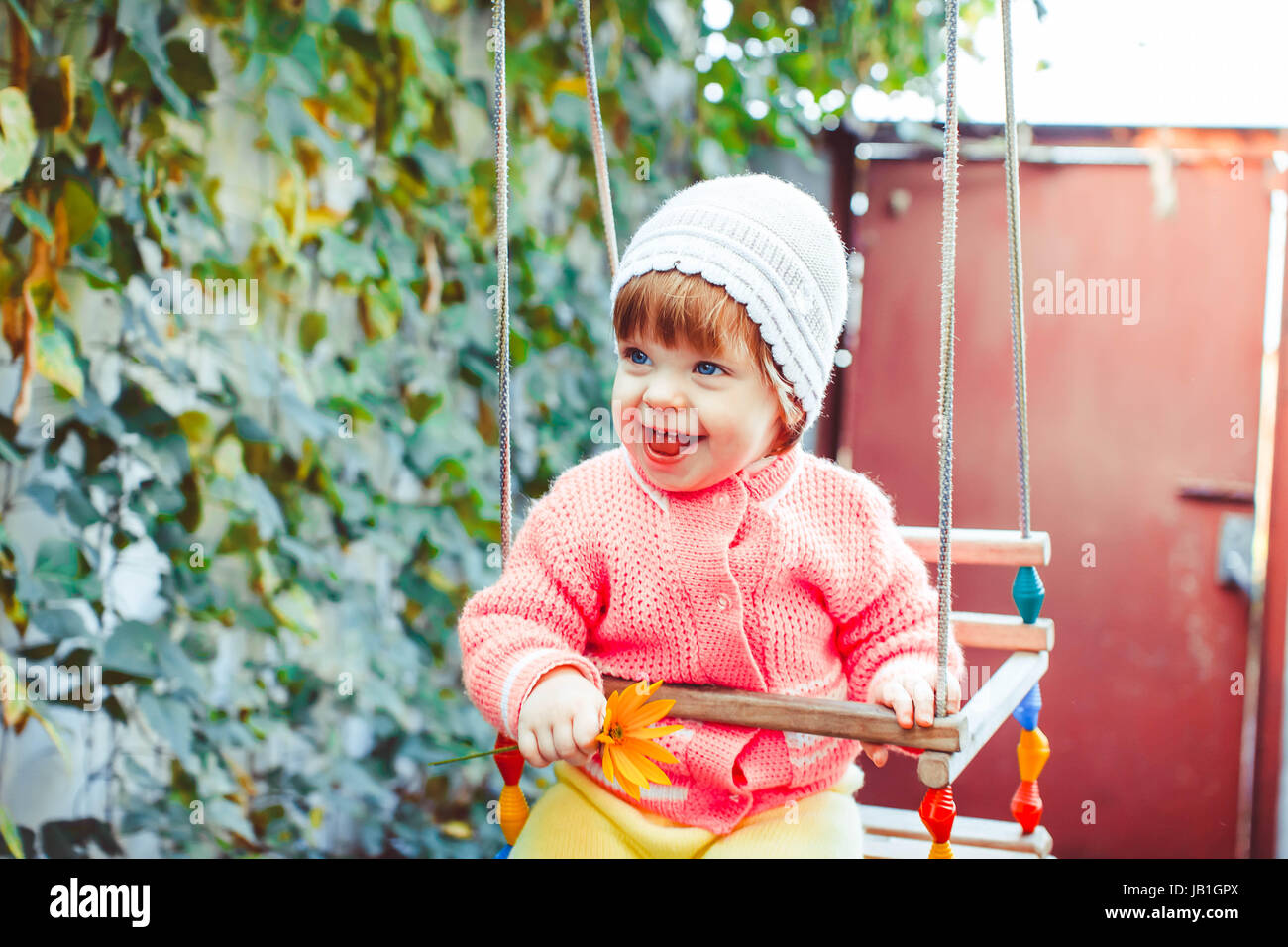 Child on the swing Stock Photo - Alamy
