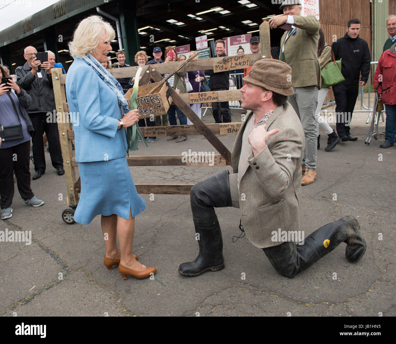 The Duchess of Cornwall jokingly knights actor Callum Arnott when she ...