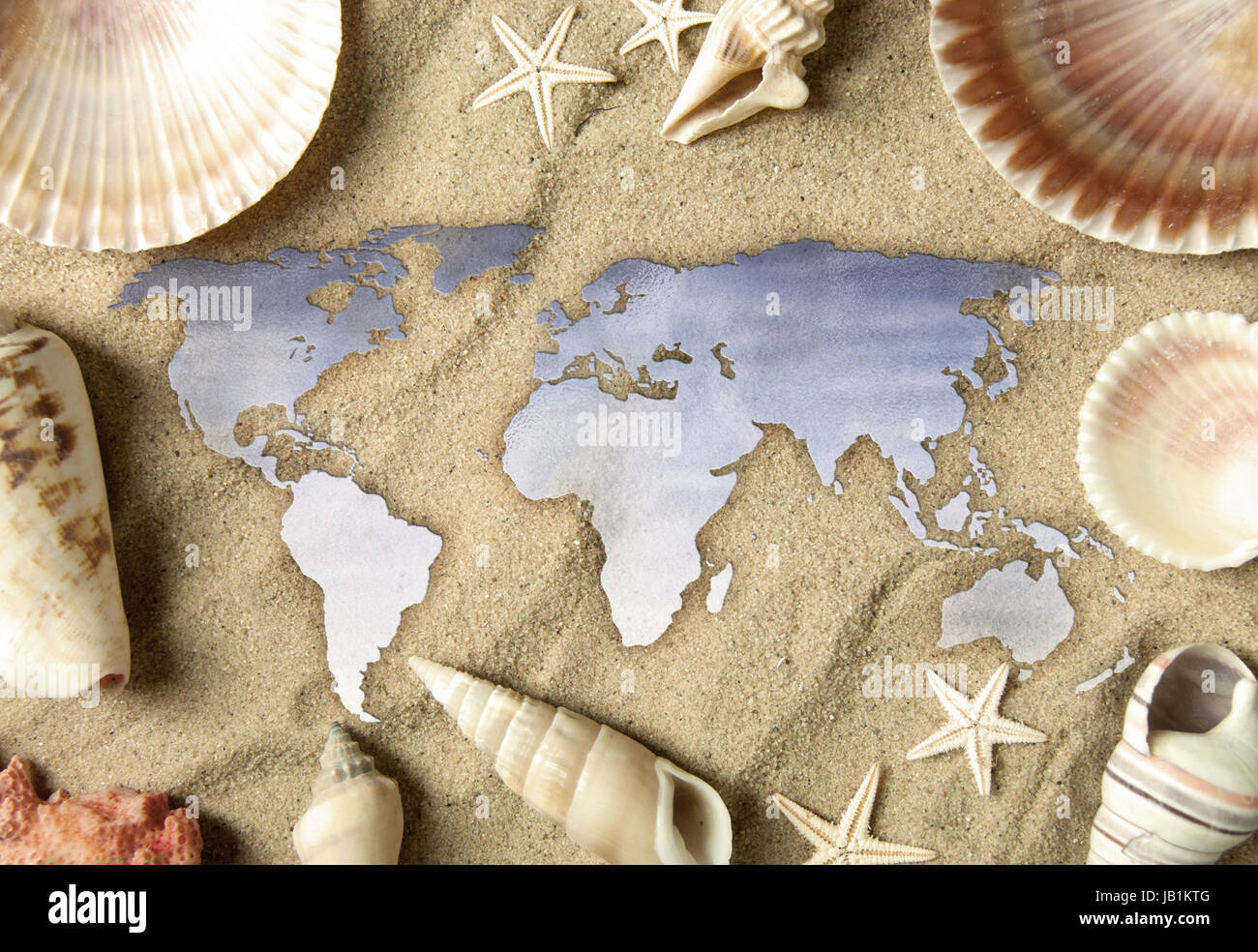 Pool of water in the shape of the world map in the sand Stock Photo - Alamy