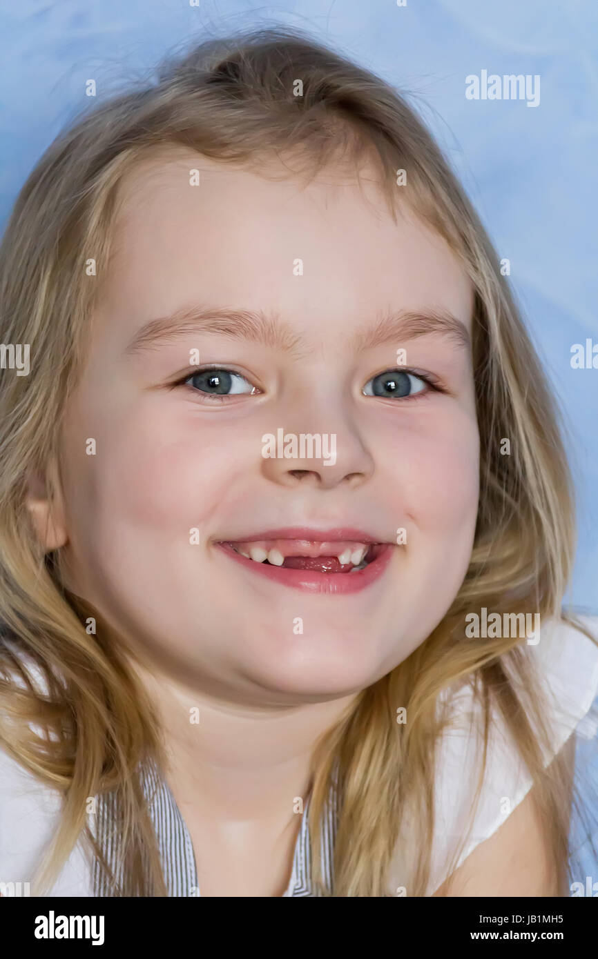 Portrait of smiling toothless girl with blond hair Stock Photo - Alamy