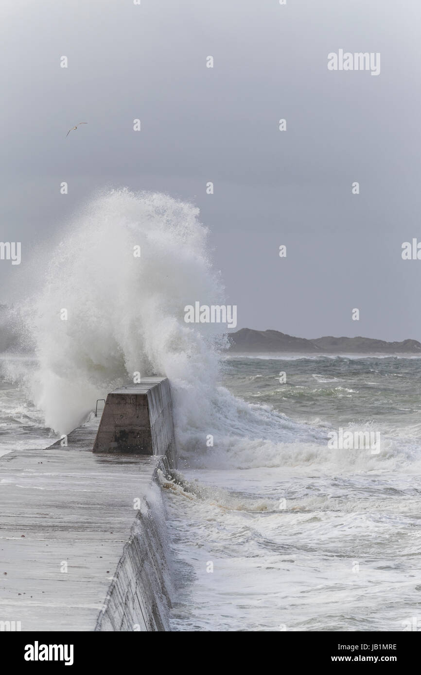Storm waves crash over the harbour wall, Seahouses, Northumberland UK Stock Photo - Alamy