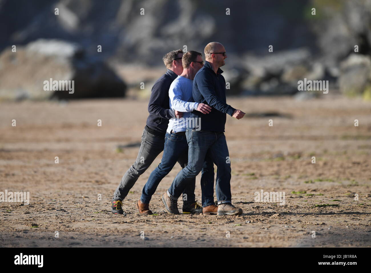 Three guys walking together in hi-res stock photography and images - Alamy