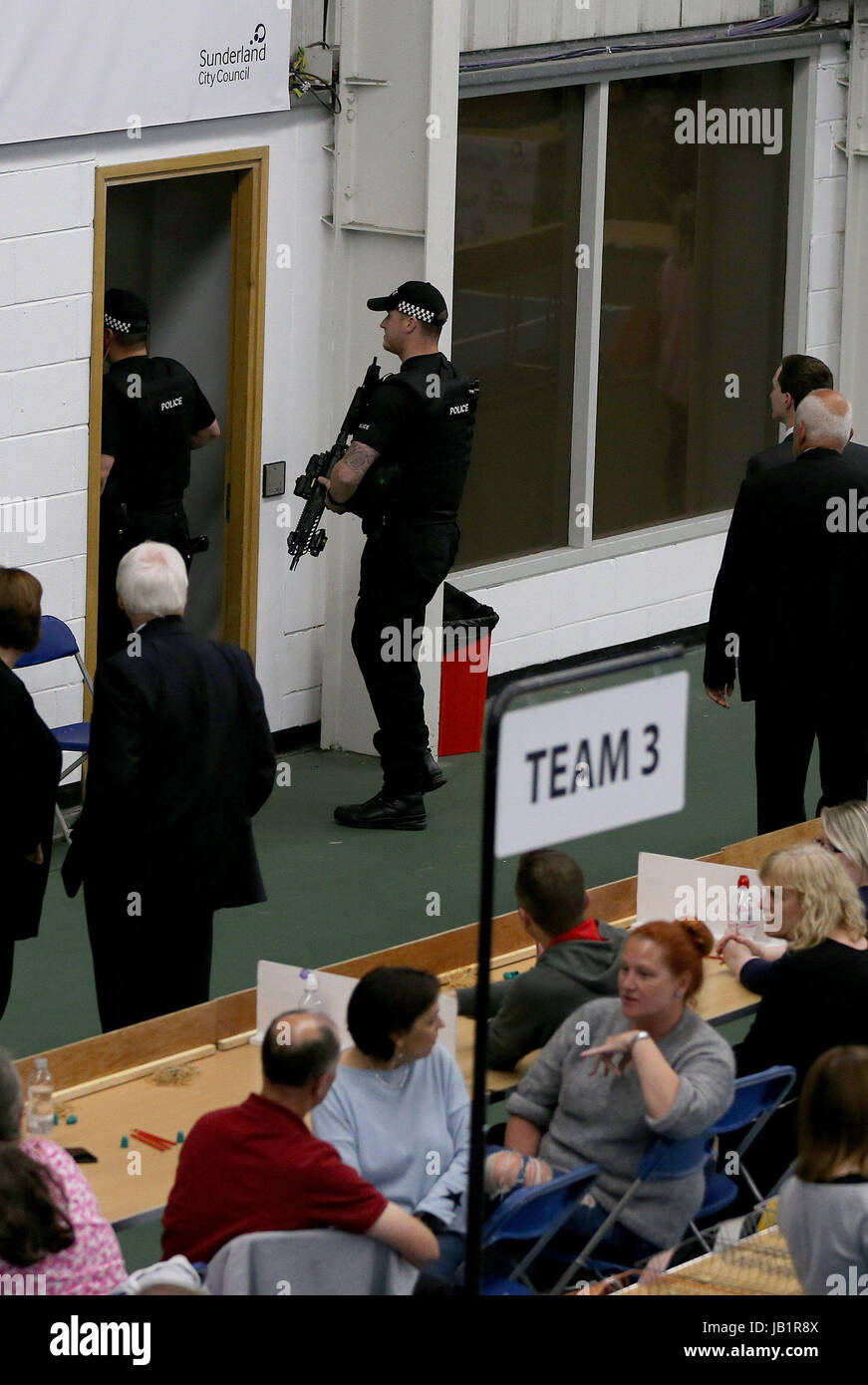 Armed police patrol the hall ahead of the General Election count at ...