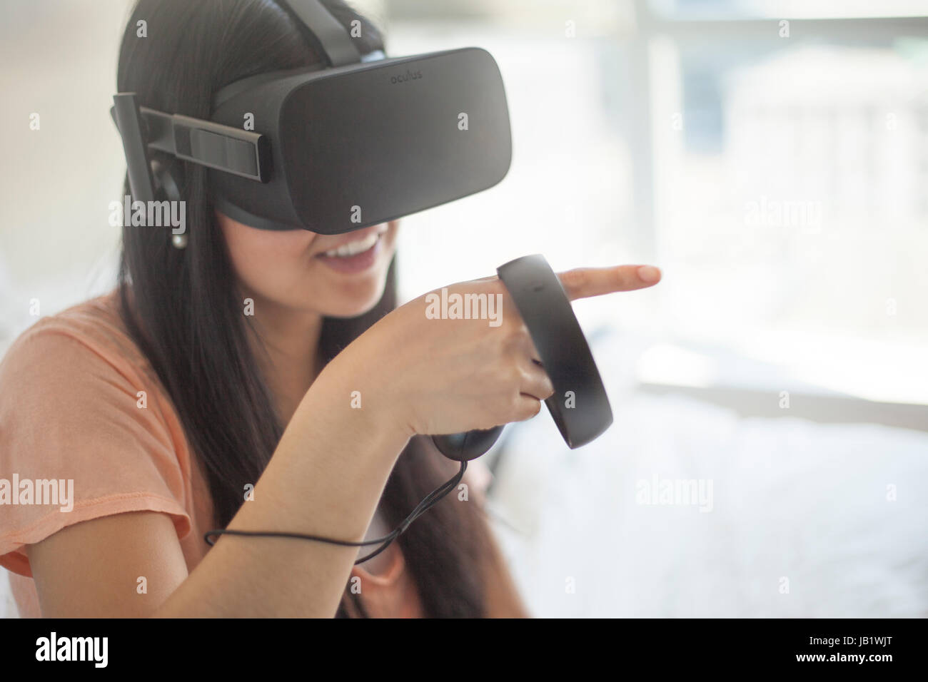 Young Asian Woman Wearing Virtual Reality Headset Oculus Rift And