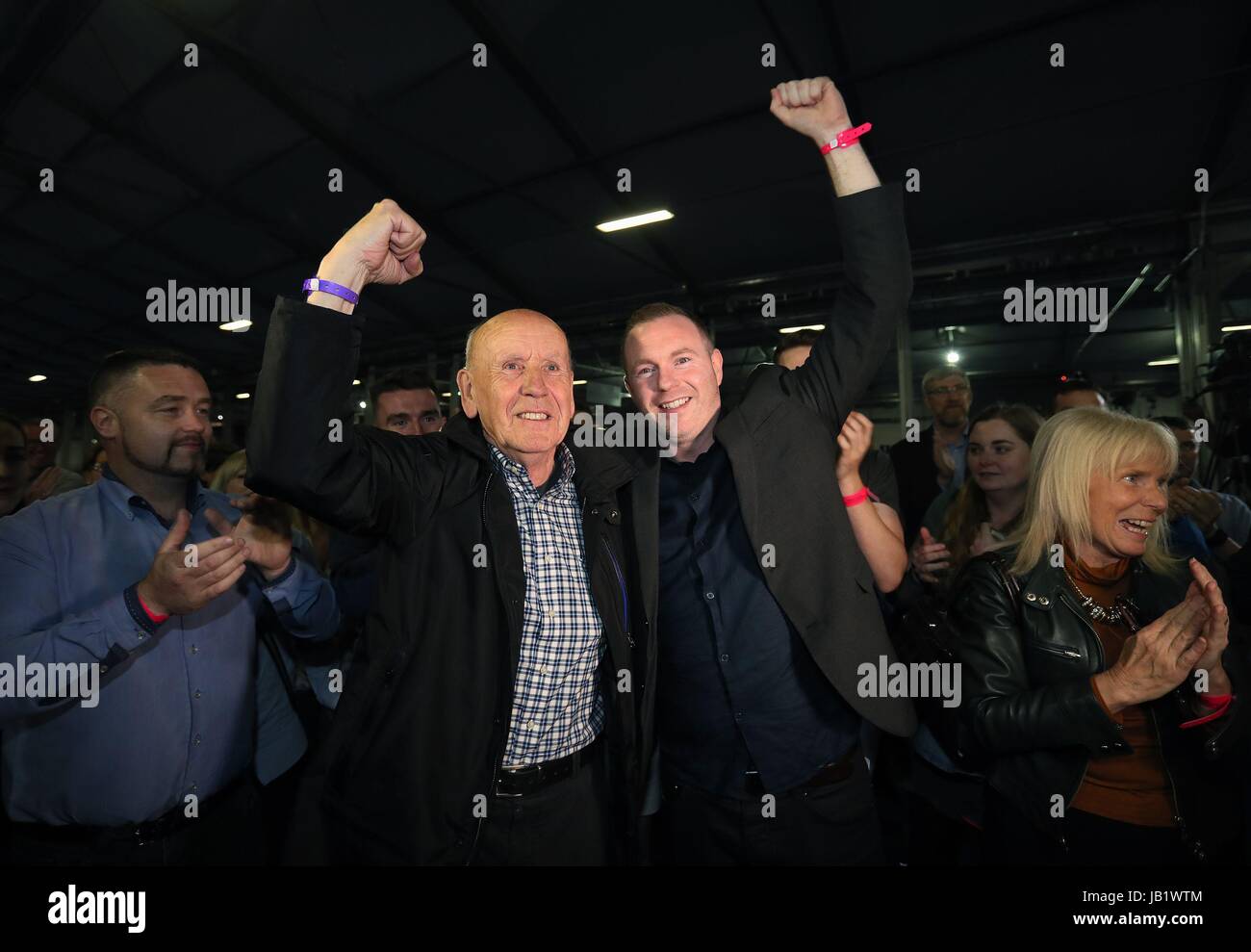 Sinn Fein candidate for South Down Chris Hazzard (right) celebrates ...