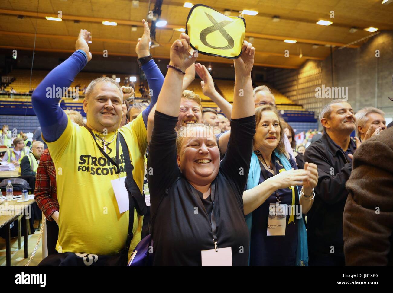 SNP supporters celebrate after their candidate for Edinburgh East Tommy ...