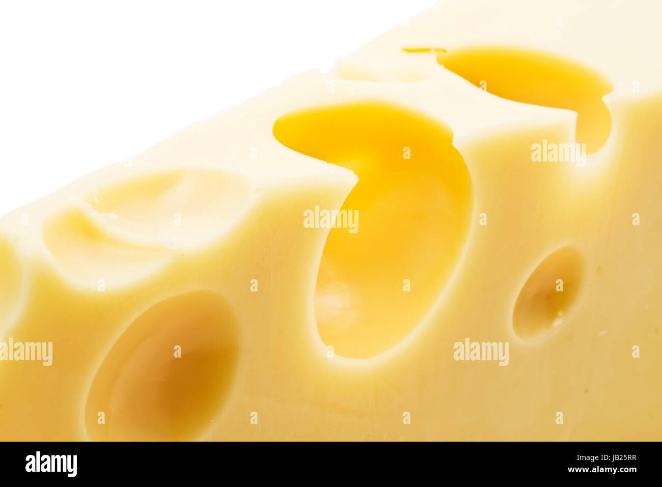 Holes in cheese, close up Stock Photo - Alamy