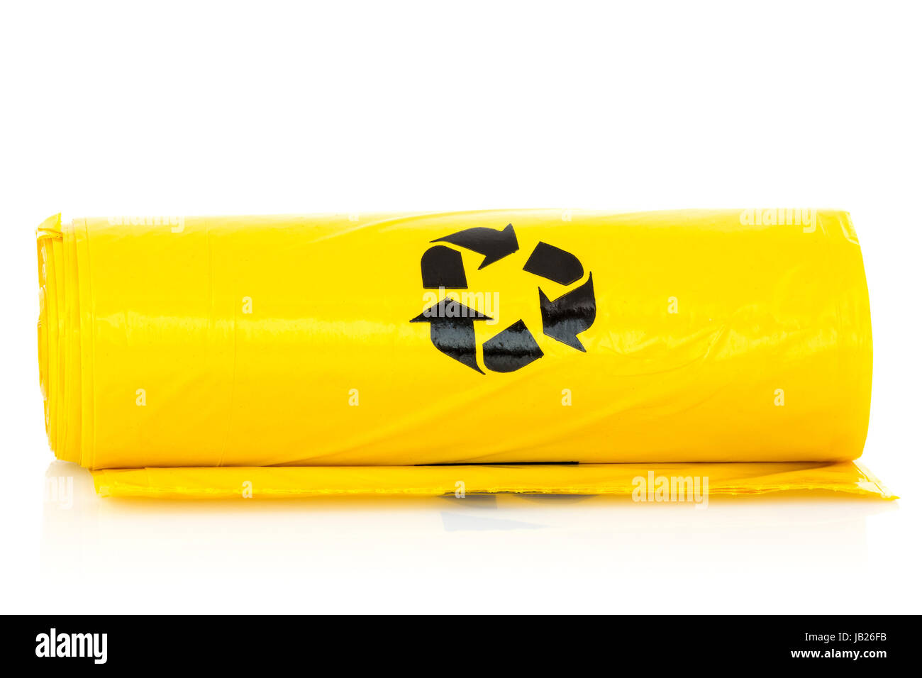 Yellow garbage bio bags in a roll on white background Stock Photo - Alamy