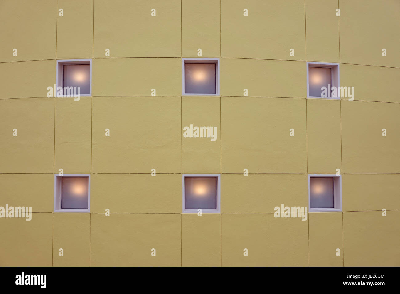 Curved Yellow Wall With Sunken Windows Stock Photo - Alamy