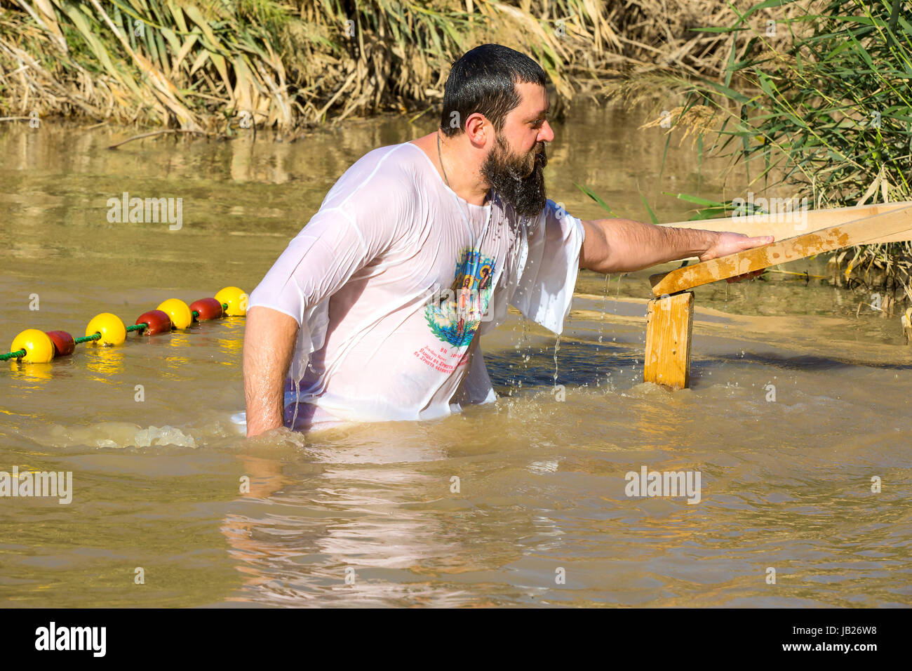 BETHABARA, JORDAN - JANUARY - 11, 2017: Man middle-aged pilgrim passes ...