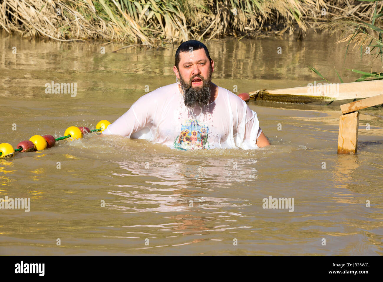 BETHABARA, JORDAN - JANUARY - 11, 2017: Man middle-aged pilgrim passes ...