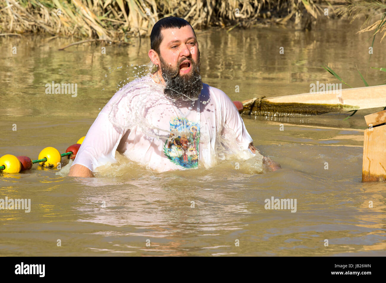 BETHABARA, JORDAN - JANUARY - 11, 2017: Man middle-aged pilgrim passes ...