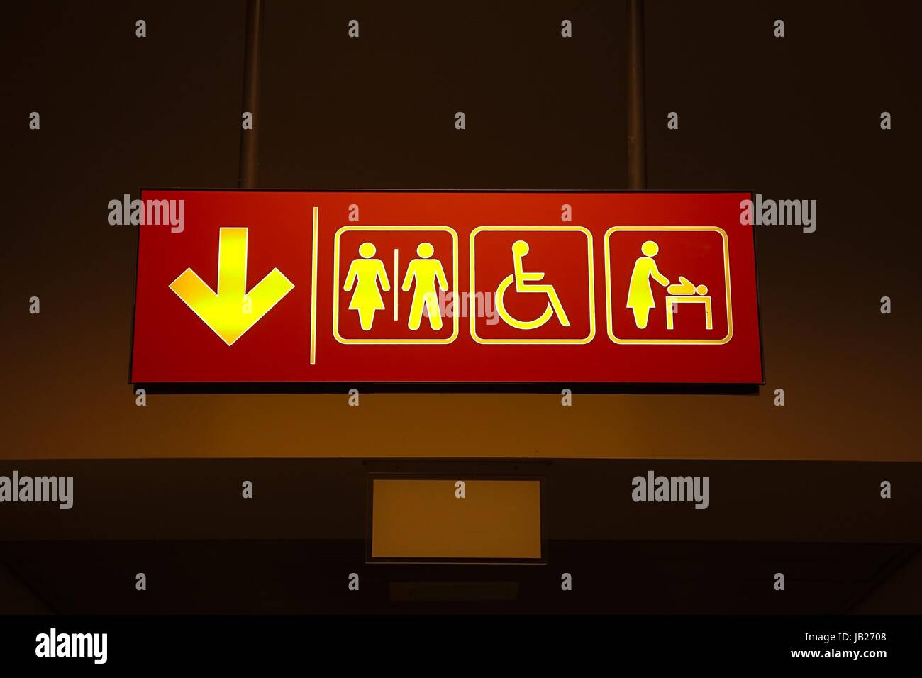 Toilets sign in a building corridor Stock Photo - Alamy