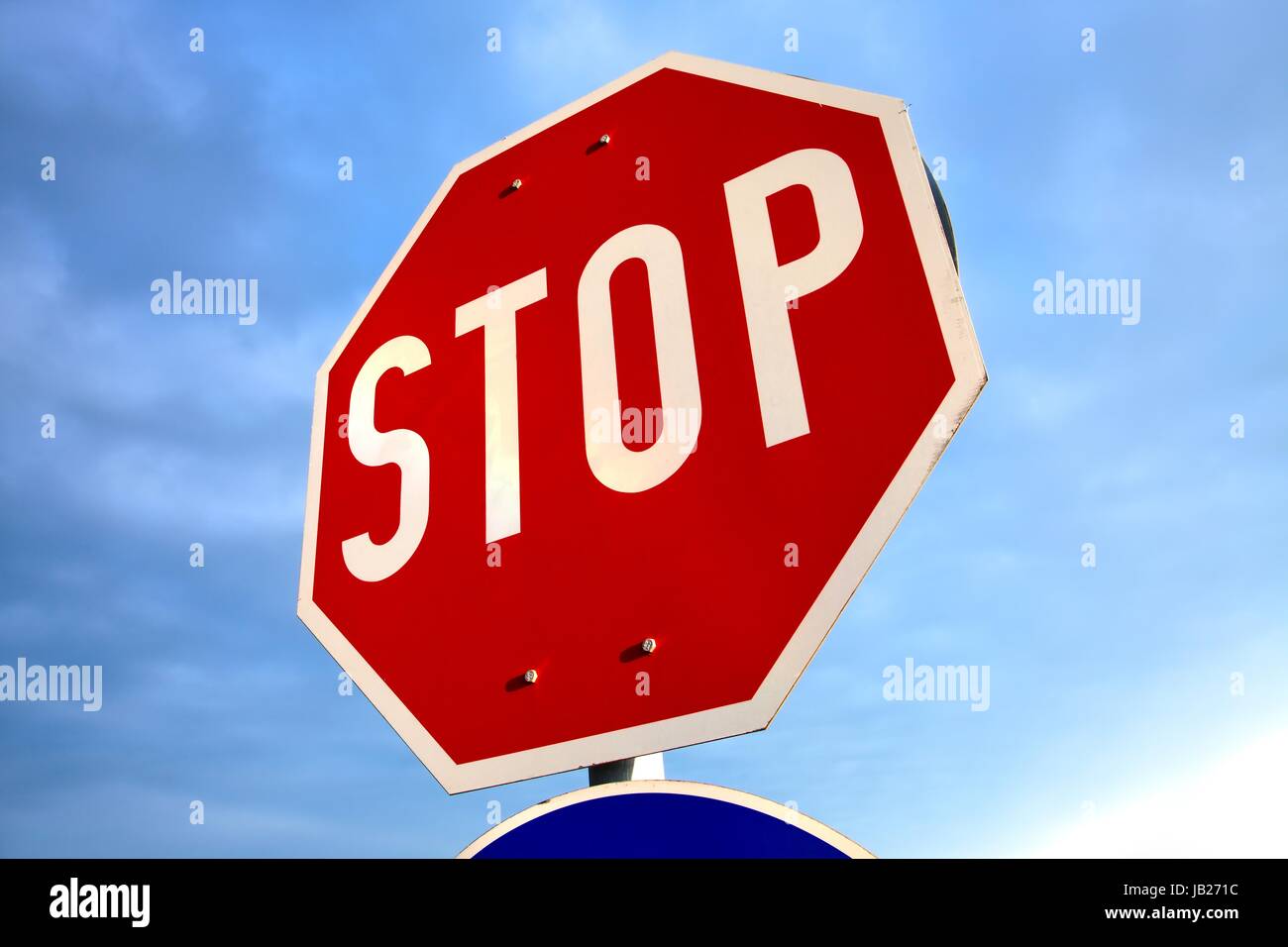 Stop sign against blue sky Stock Photo - Alamy