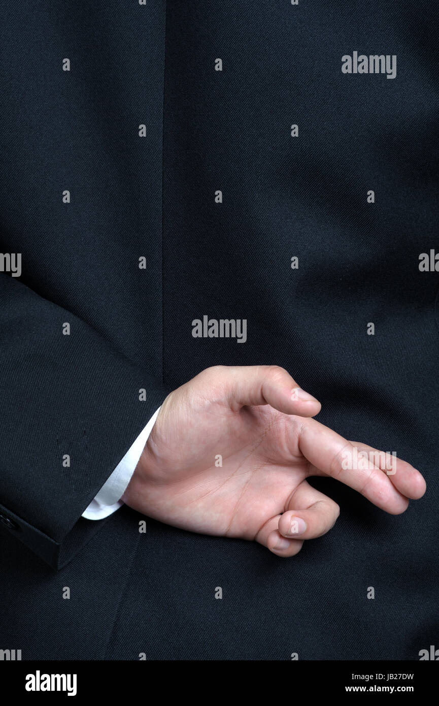 Lying fingers crossed behind back hi-res stock photography and images ...