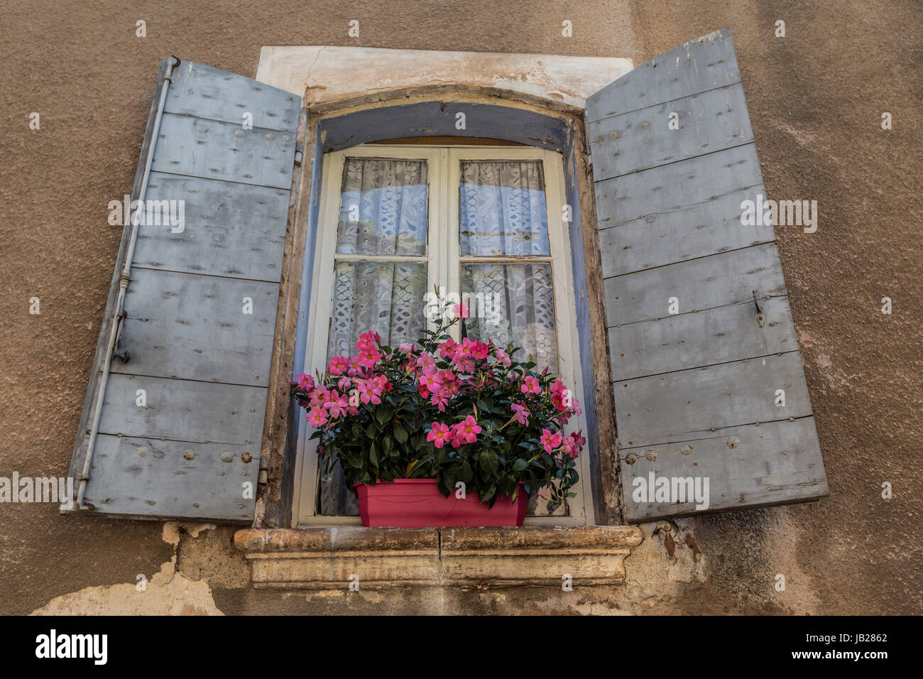 Typical iconic window located in old city of Provence, France Stock ...