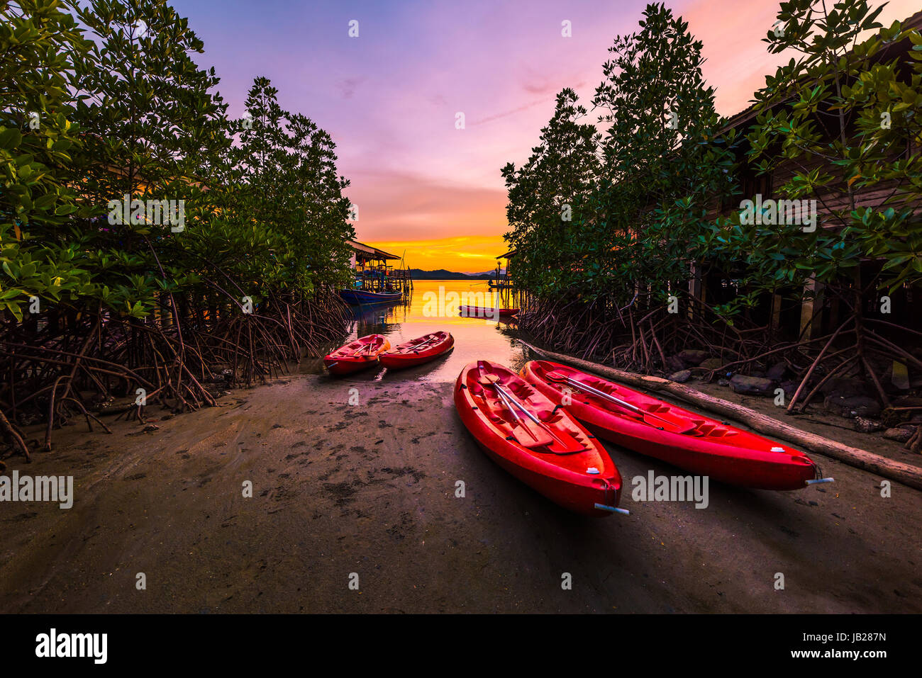 Red sea kayaks in the evening,in thailand Stock Photo - Alamy