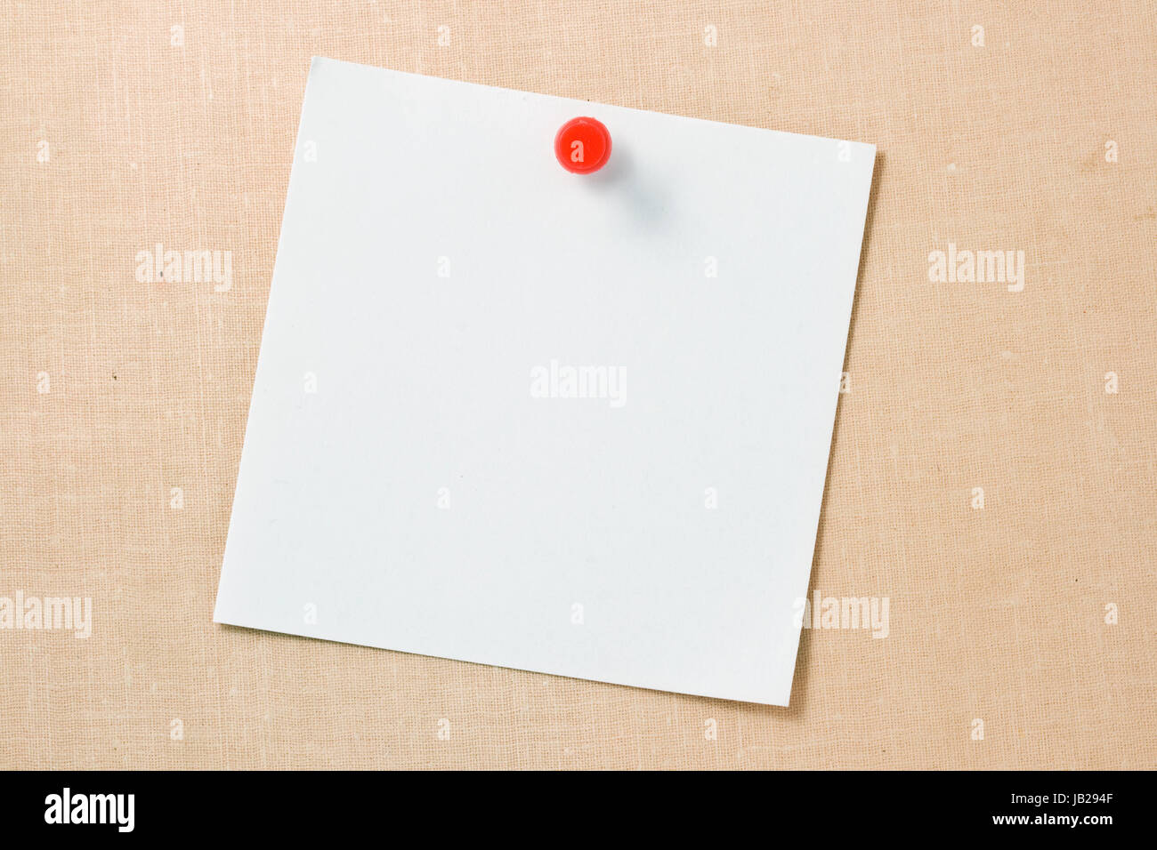 Note white paper tacked on a wall Stock Photo - Alamy