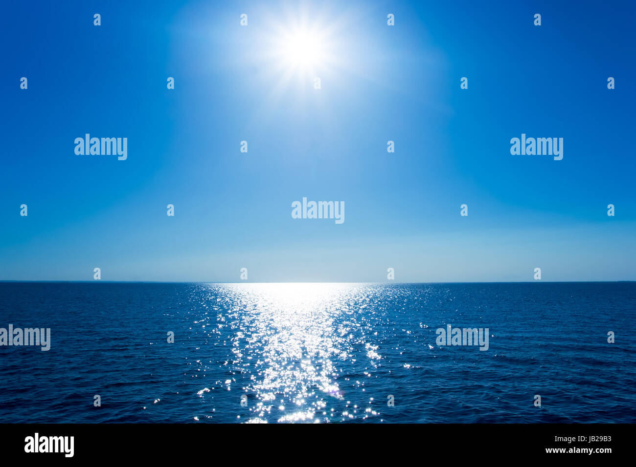 Beautiful calm sea and shining summer sun Stock Photo - Alamy