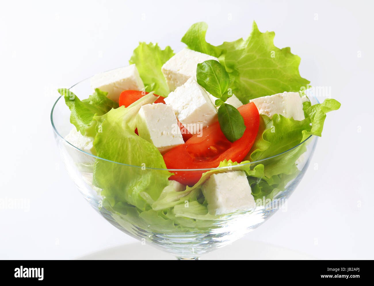 Diced feta cheese with fresh vegetable salad Stock Photo - Alamy