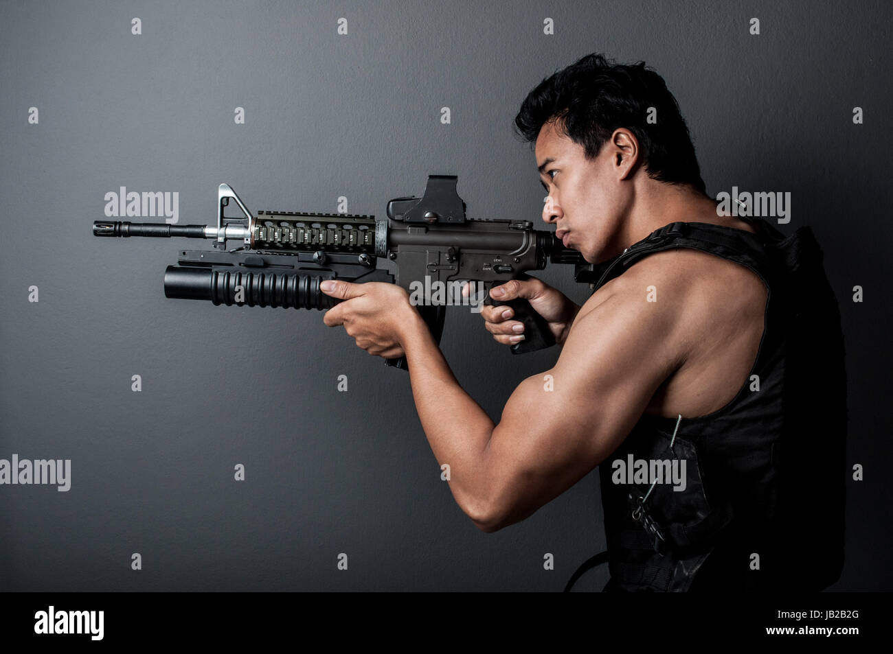 soldier hold Machine gun shoot Stock Photo - Alamy