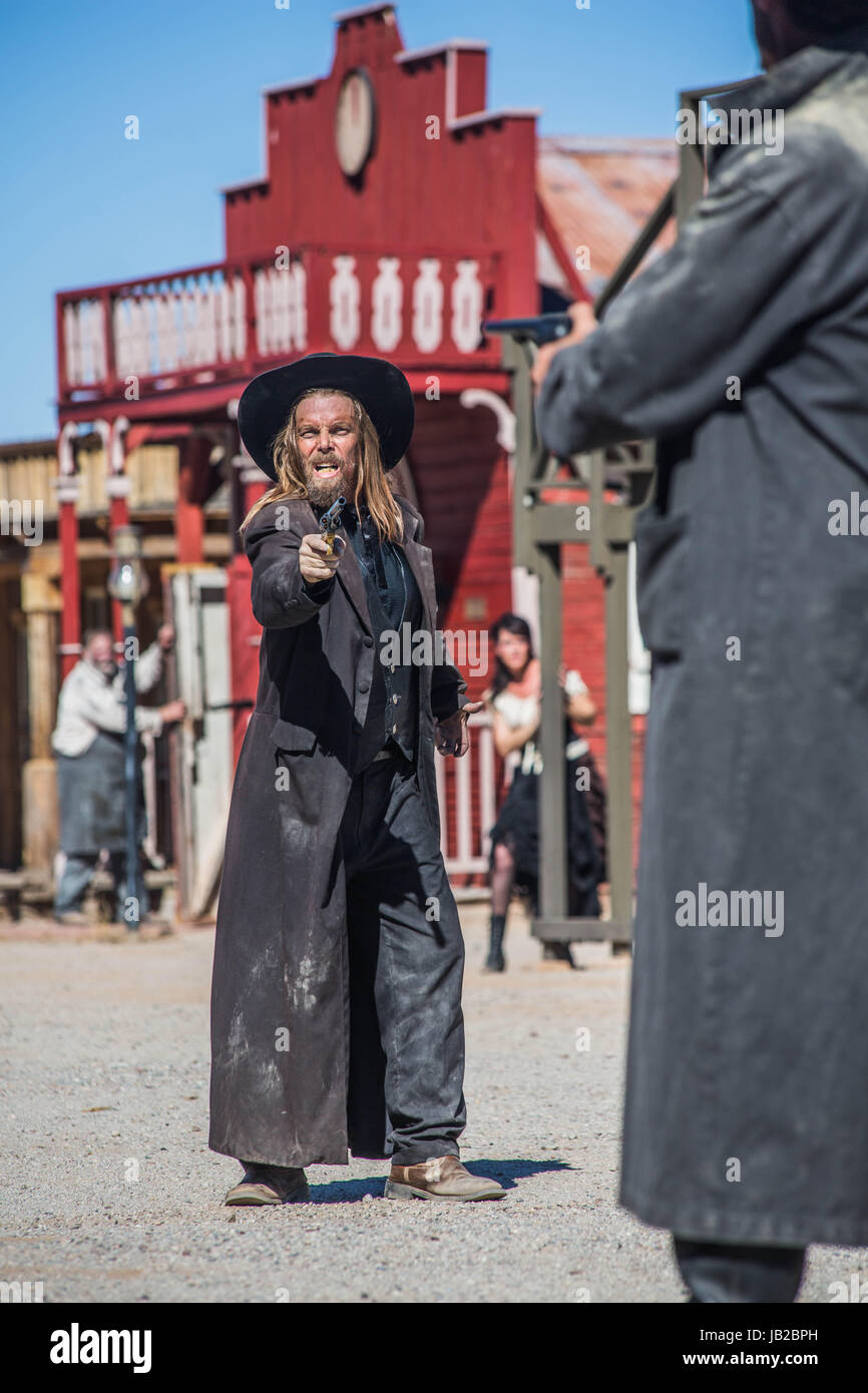 Two cowboys shooting at each other hi-res stock photography and images ...