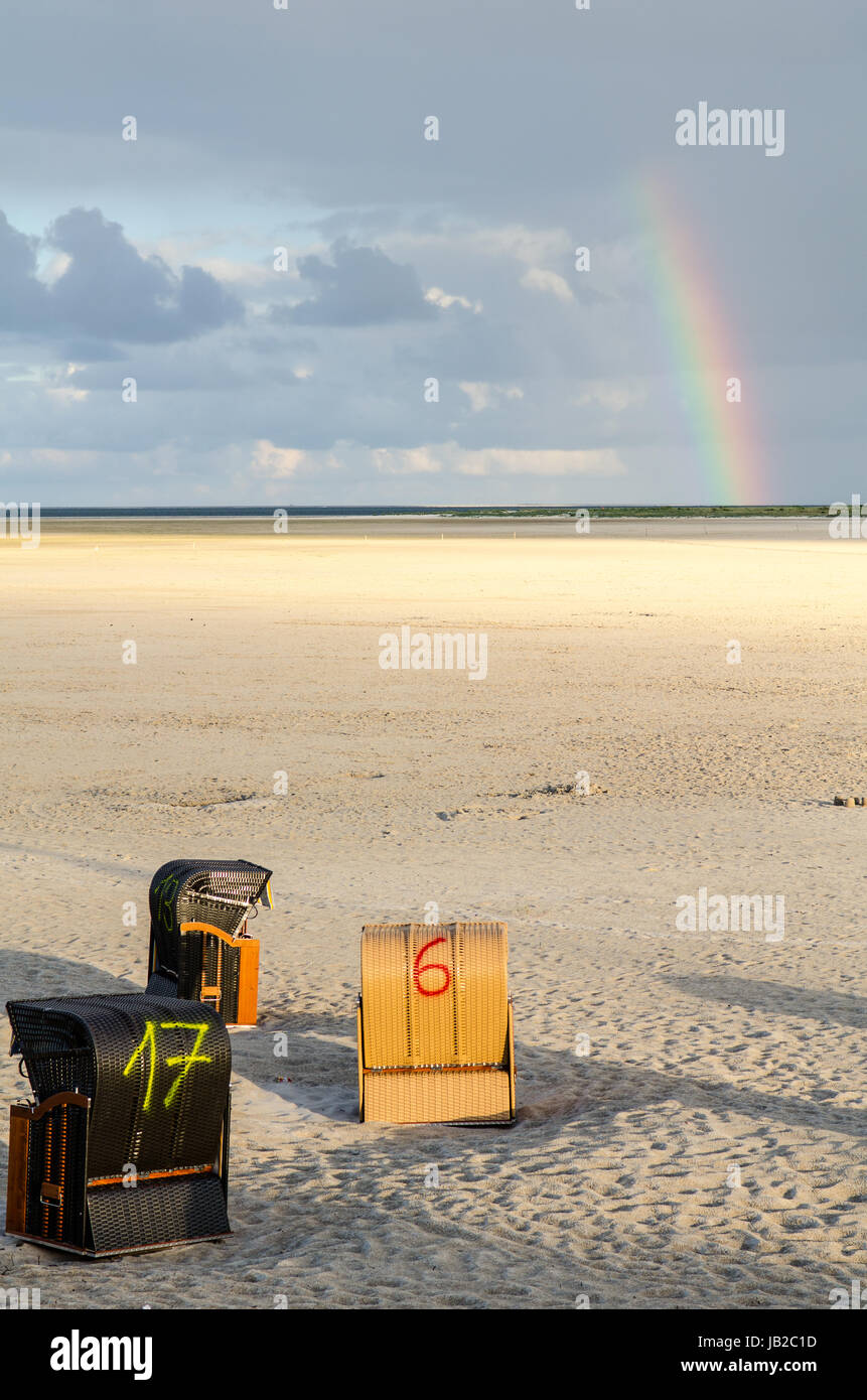 large beach with beach chairs, rainbow Stock Photo - Alamy