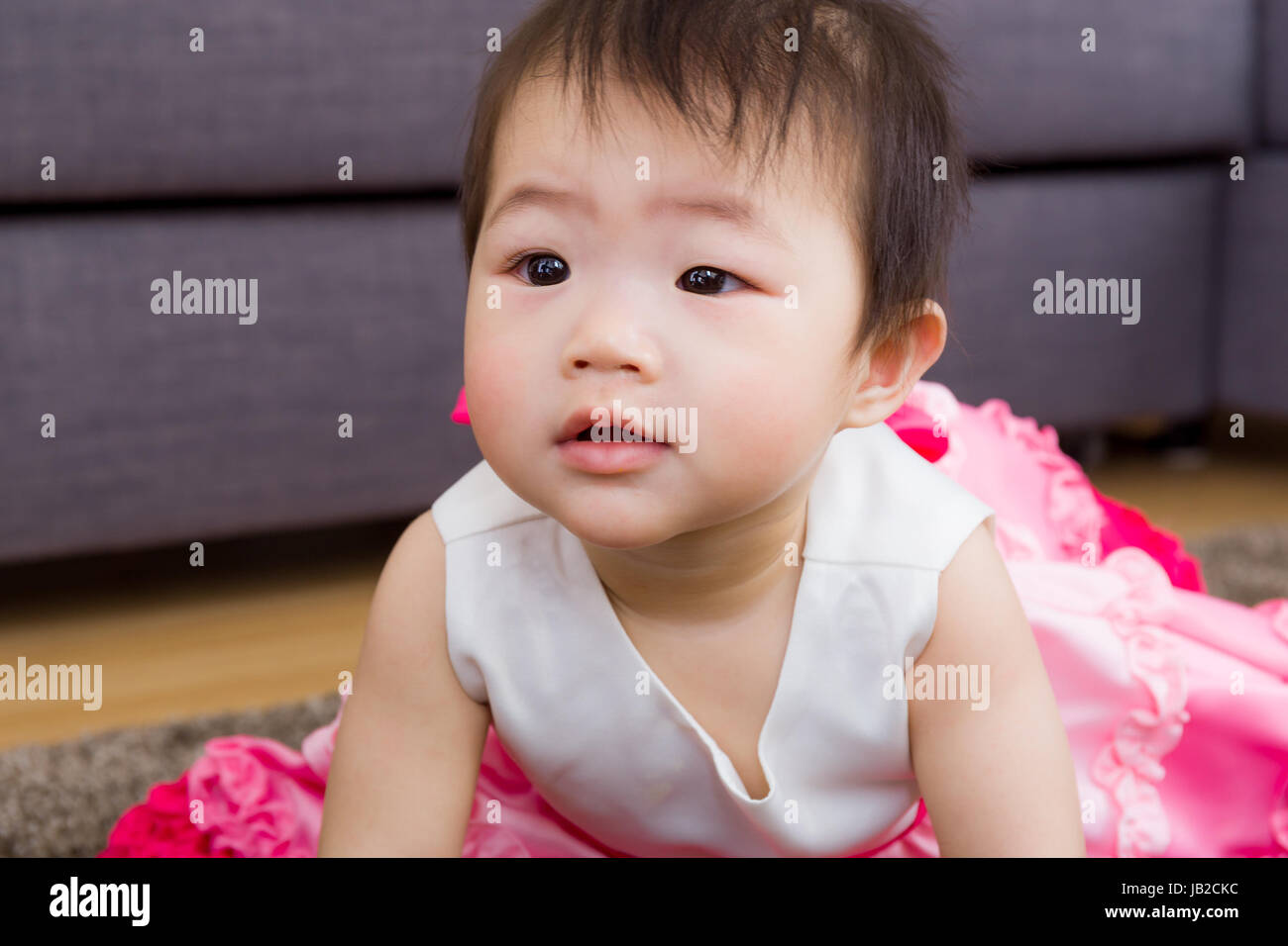 Baby girl feel curiosity Stock Photo - Alamy