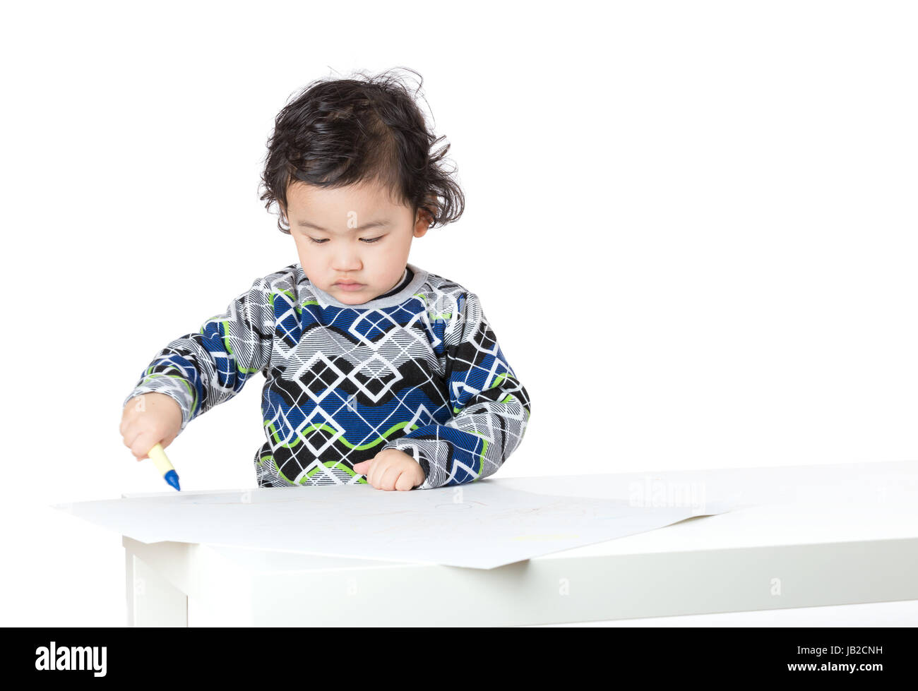 Baby boy concentration on drawing and isolated on white Stock Photo - Alamy