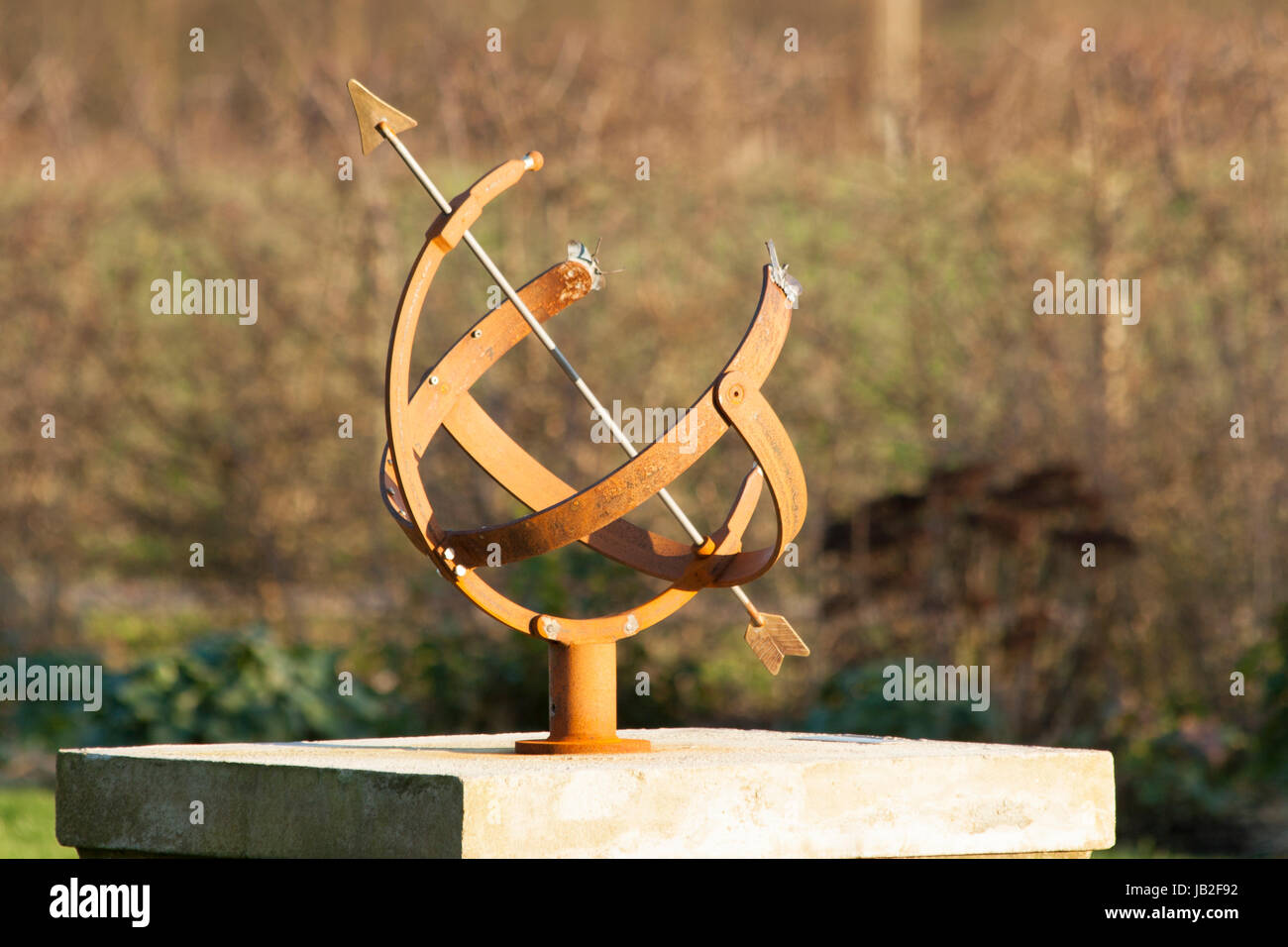 Iron sundial in the garden ancient clock Stock Photo - Alamy